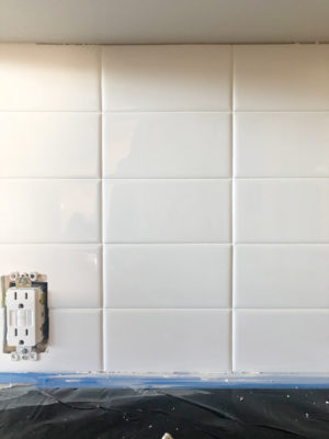 Installing a stacked bond subway tile backplash. | Door Sixteen