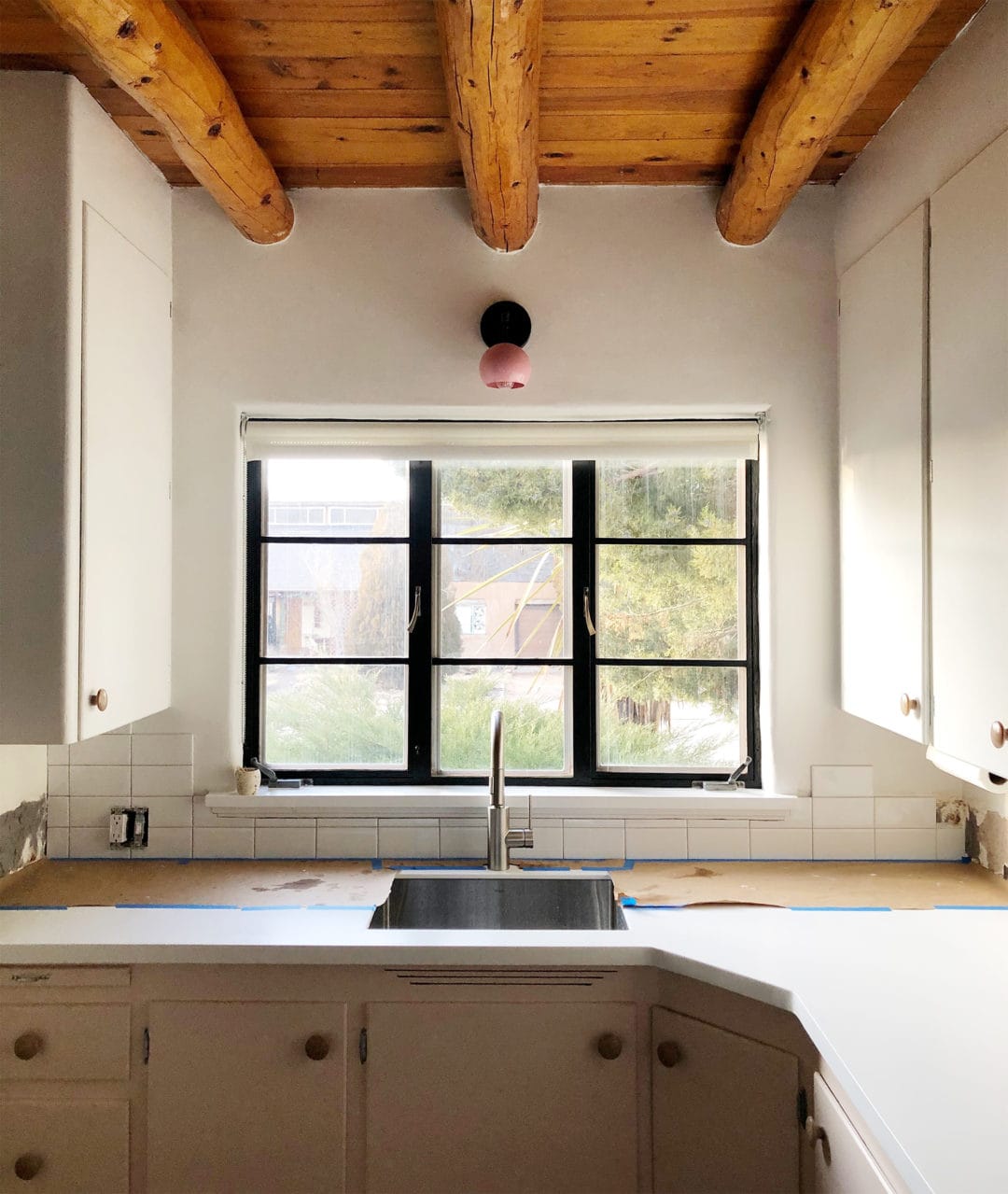 Installing a stacked bond subway tile backplash. | Door Sixteen